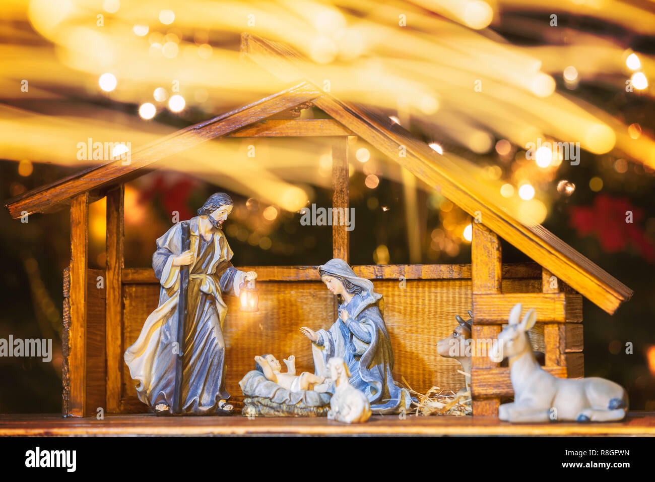 Christmas Manger scene with figurines including Jesus, Mary, Joseph and ...