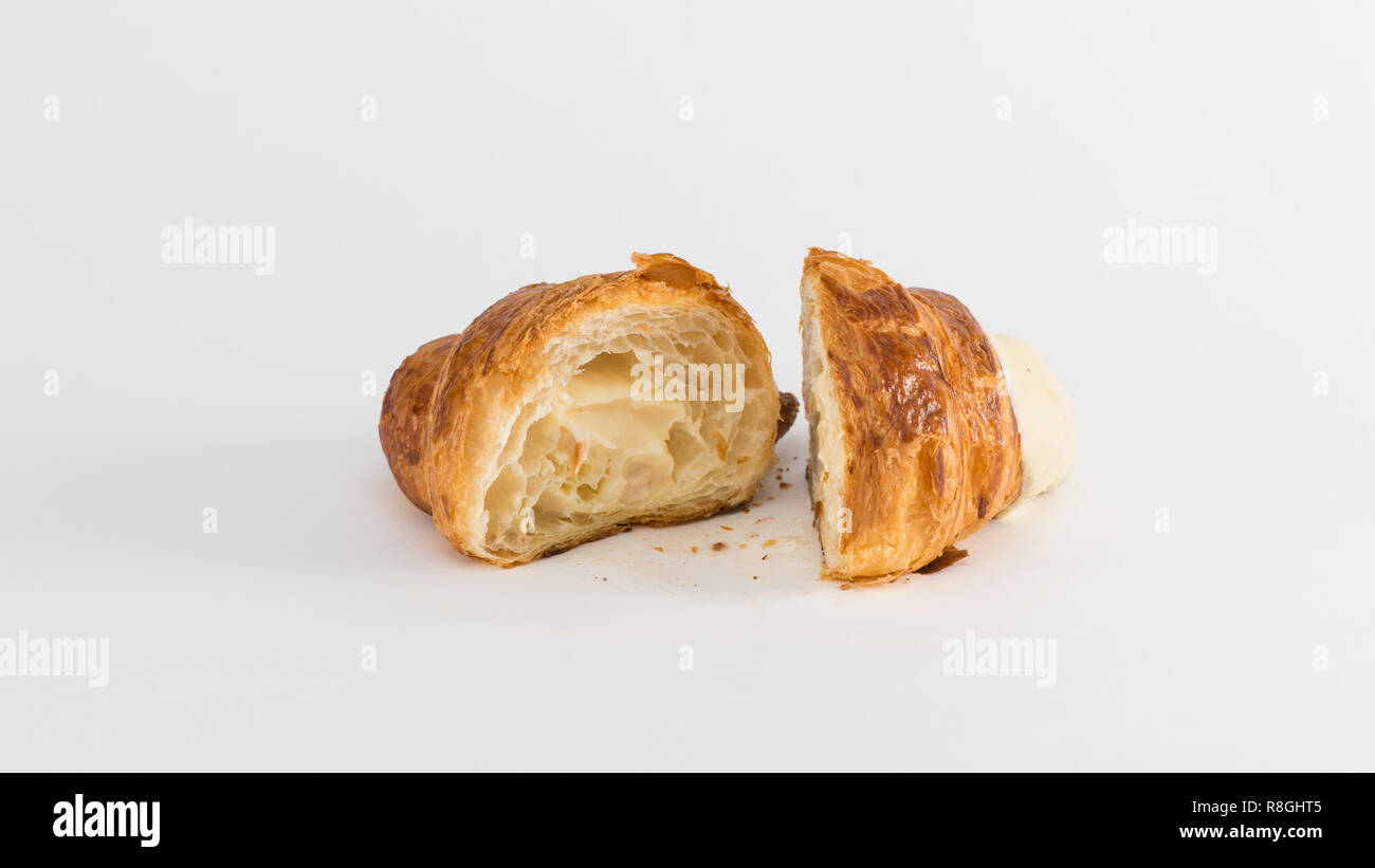sliced croissant with cream filling on a white background Stock Photo ...