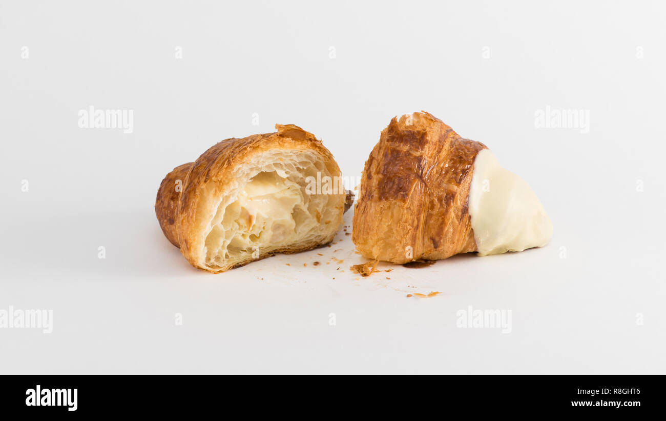 sliced croissant with cream filling on a white background Stock Photo ...