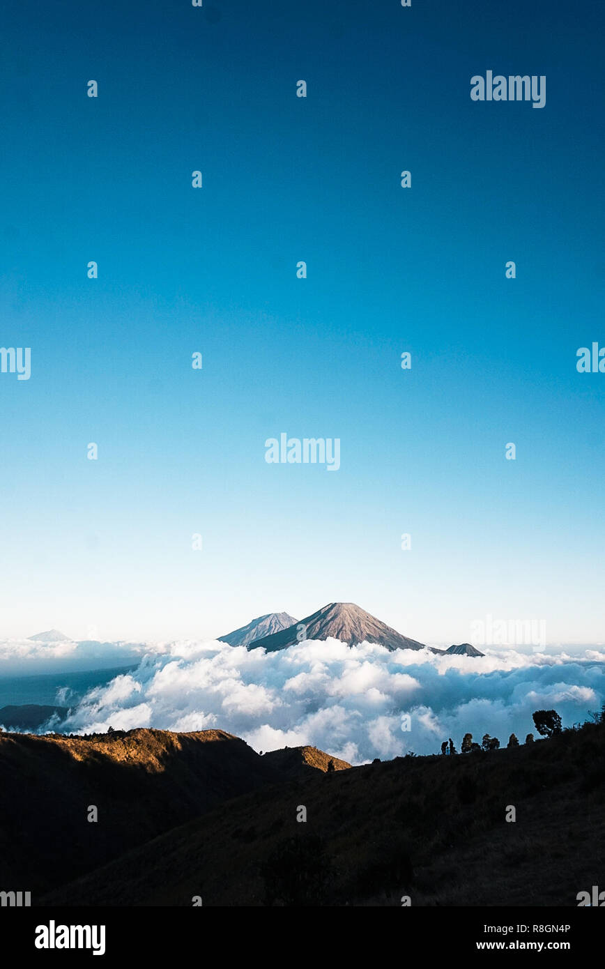 Mountain With Clear Blue Sky Background Stock Photo - Alamy