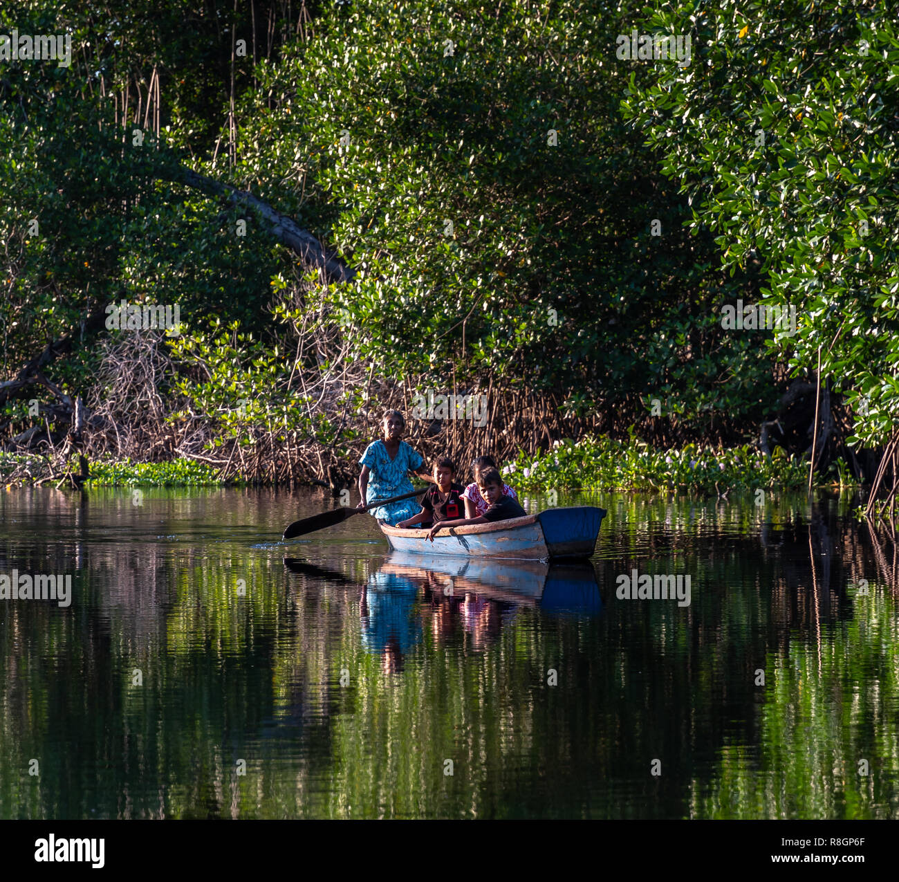 Guatemalan family in small boat Stock Photo - Alamy
