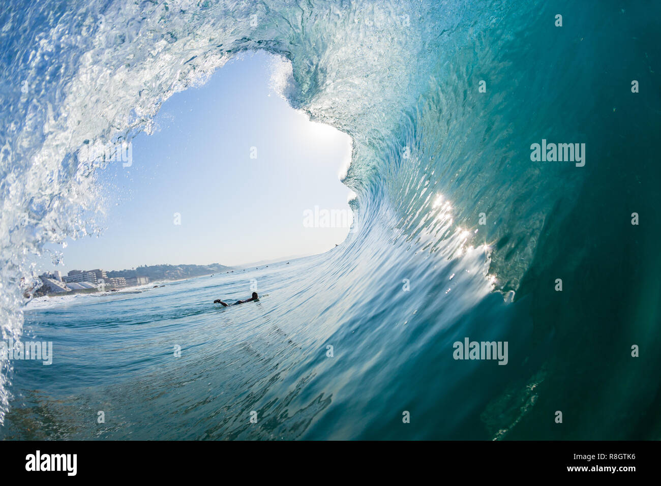 Surfer's view tube ride inside ocean blue wave crashing hollow water ...