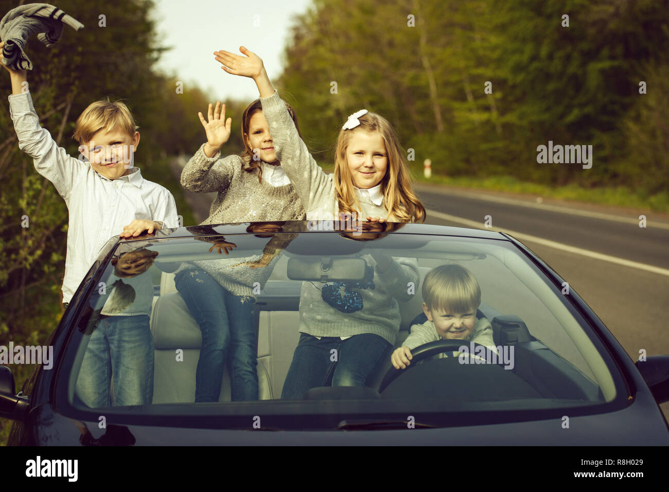 happy children friends in car Stock Photo - Alamy