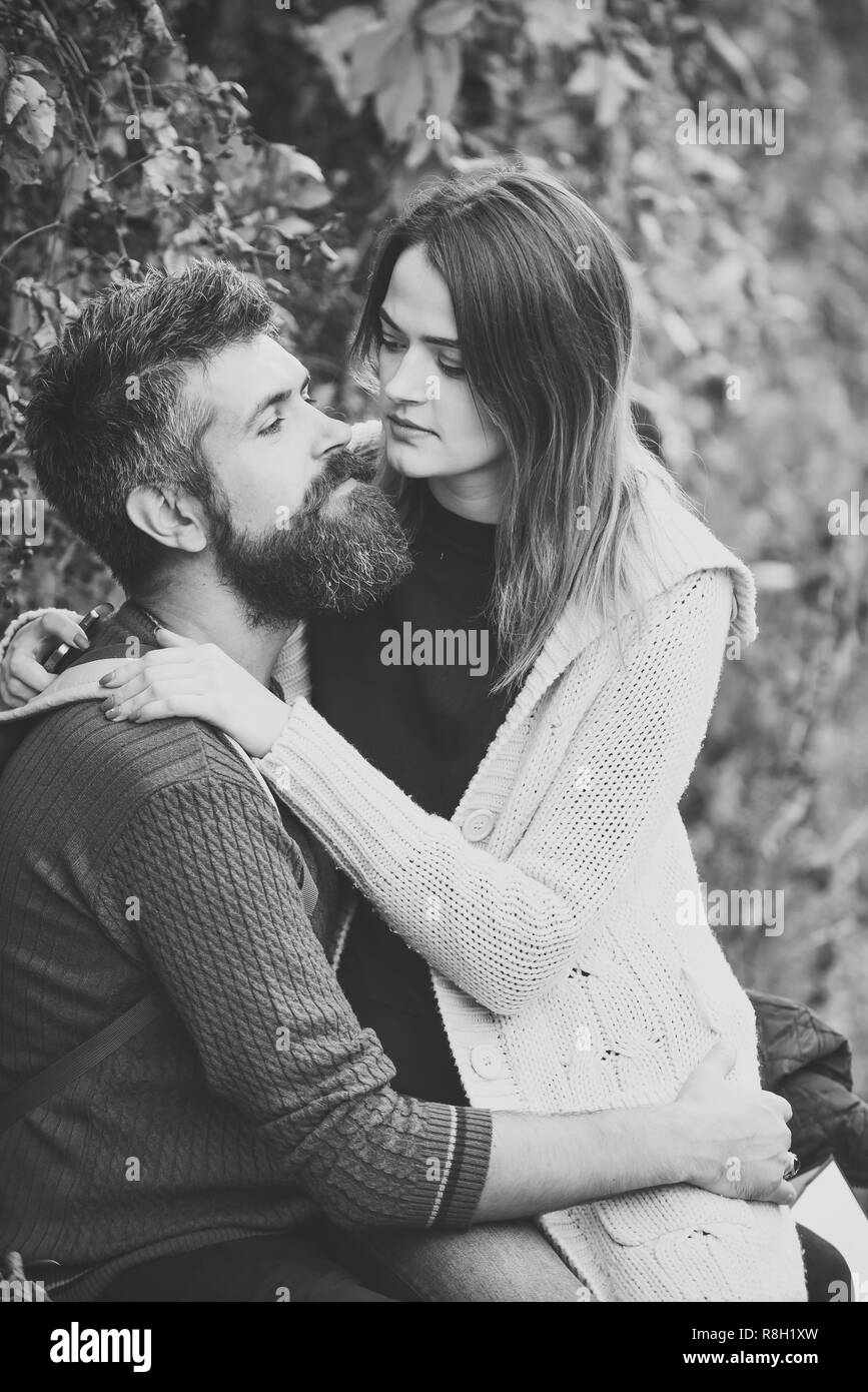 Couple in love hugs with red leaves on background Stock Photo - Alamy