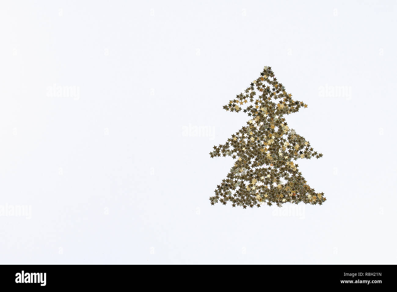 Christmas layout. Golden confetti in the form of stars folded in the ...