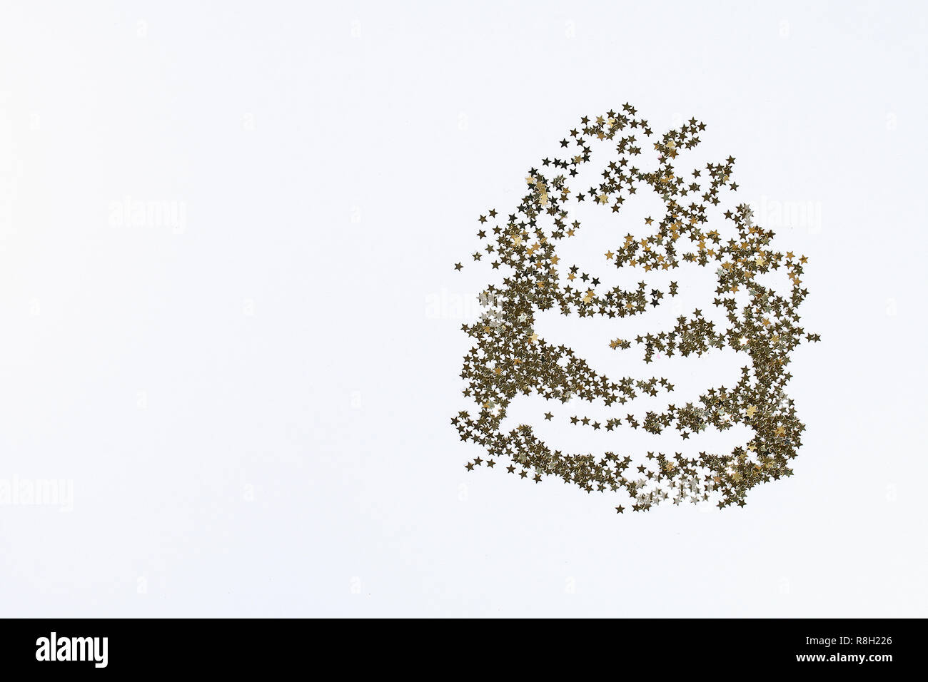 Christmas layout. Golden confetti in the form of stars folded in the ...