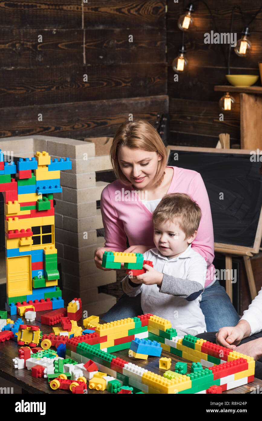 Mother concept. Mother and son play toy bricks. Mother and child ...
