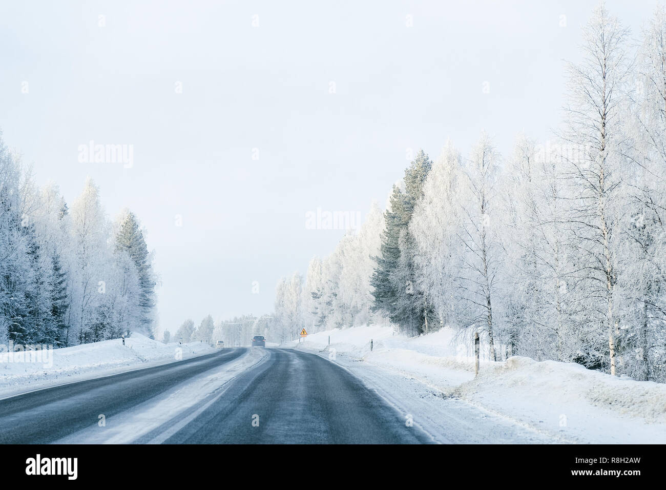 Winter road and Snowy Forest at Cold Finland of Lapland Stock Photo - Alamy