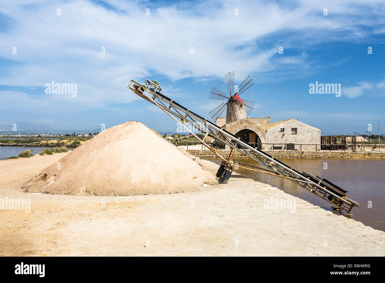 Heap of salt with a typical windmill at Trapani and Paceco salt ...