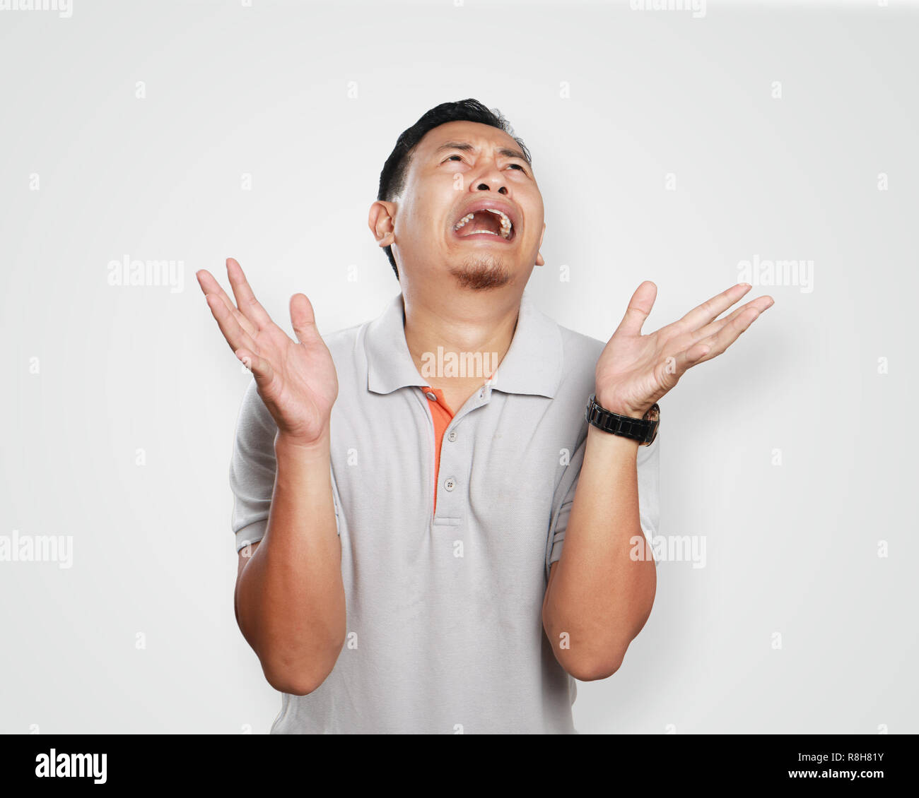 Photo image portrait of a cute handsome young Asian man crying hard and ...