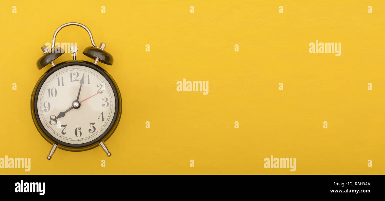 Analog alarm clock on yellow color background, timing theme Stock Photo ...