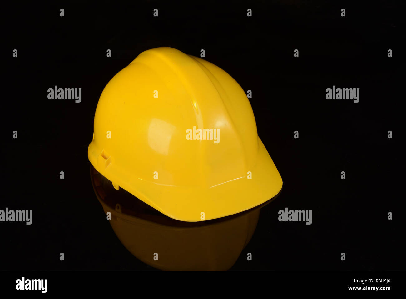 Yellow safety cap material work protect engineering on black background ...