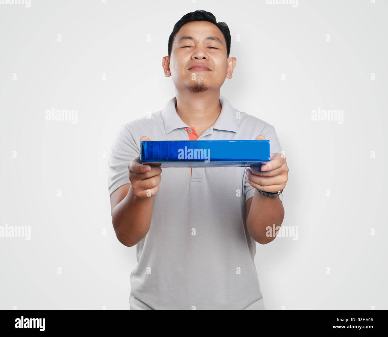 Photo image portrait of a cute handsome young Asian man smiling while ...
