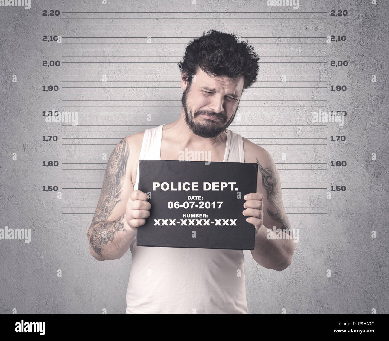 Caught gangster in jail with table on his hand Stock Photo - Alamy