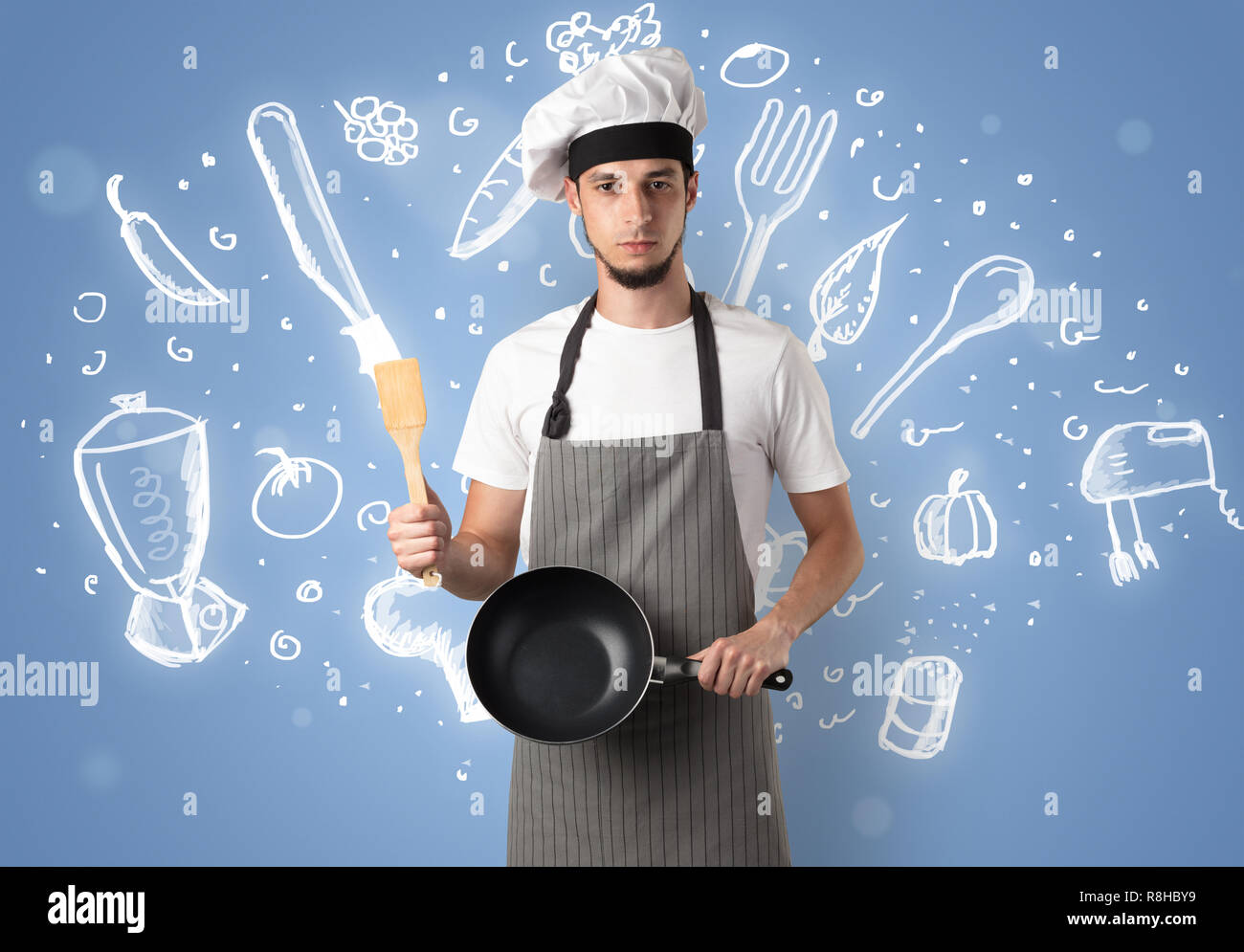 Young cook with kitchen instruments and drawn recipe concept on ...