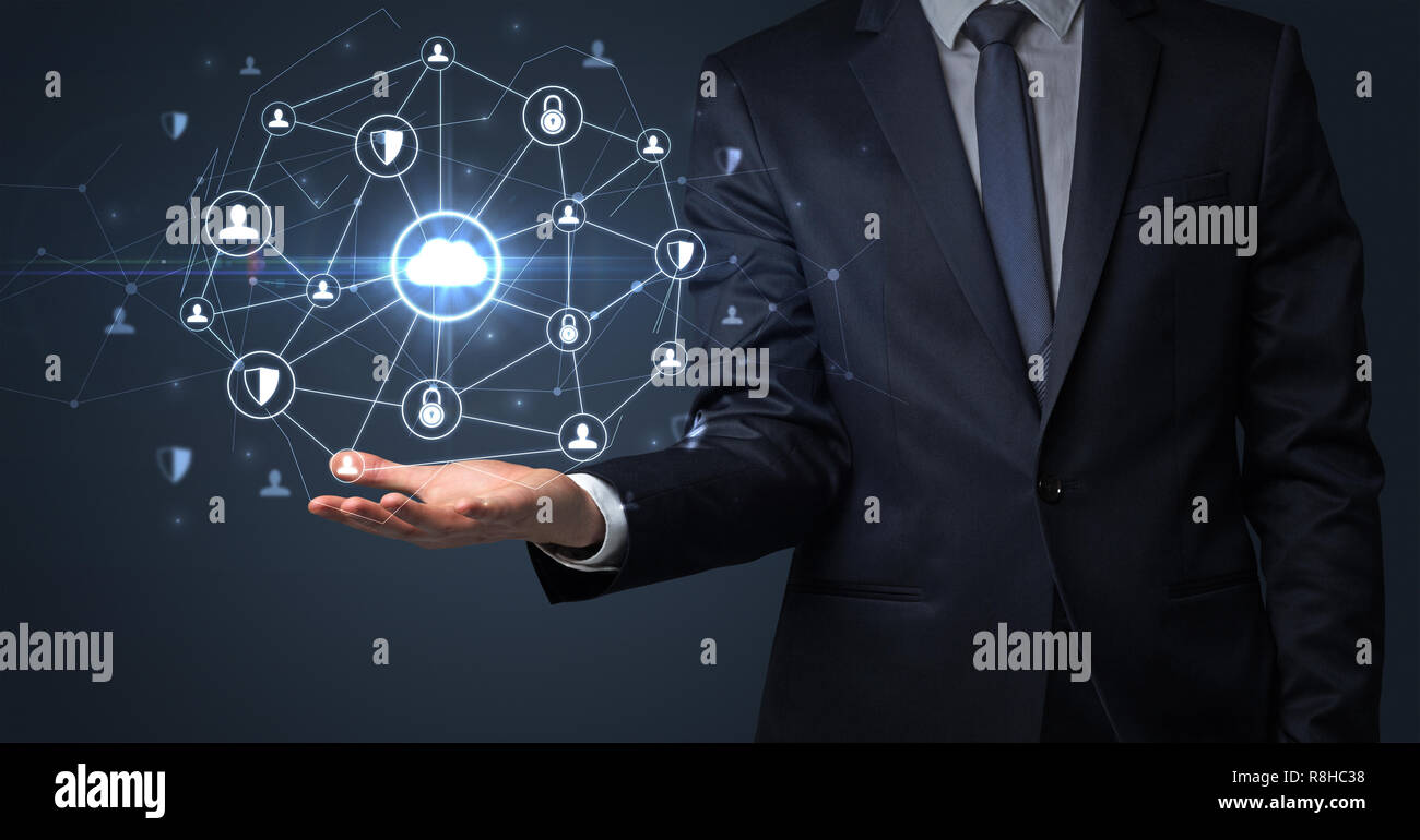 Businessman holding networking connection concept with dark wallpaper ...