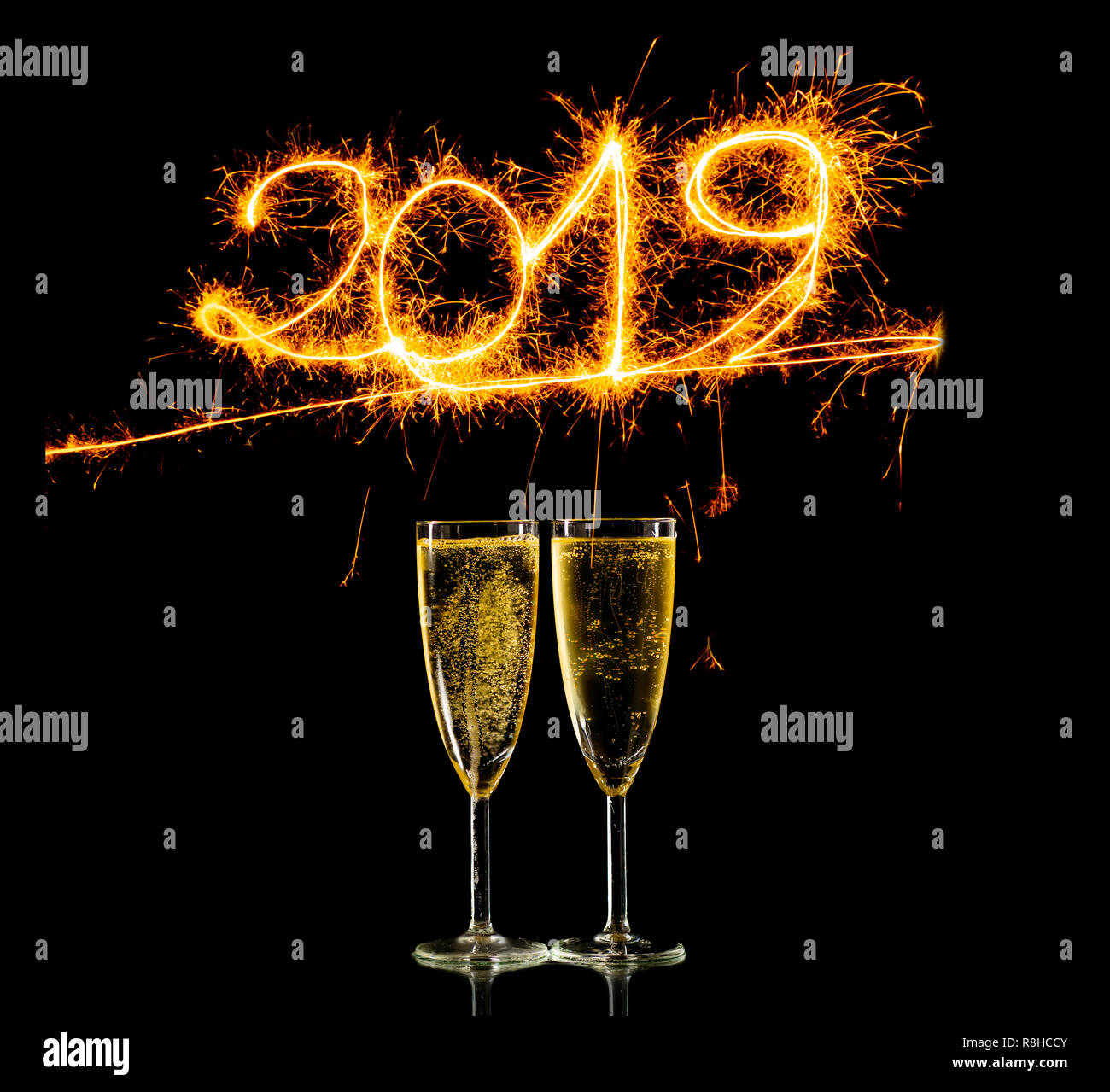 Happy New Year two glasses of champagne and beautiful shining golden ...