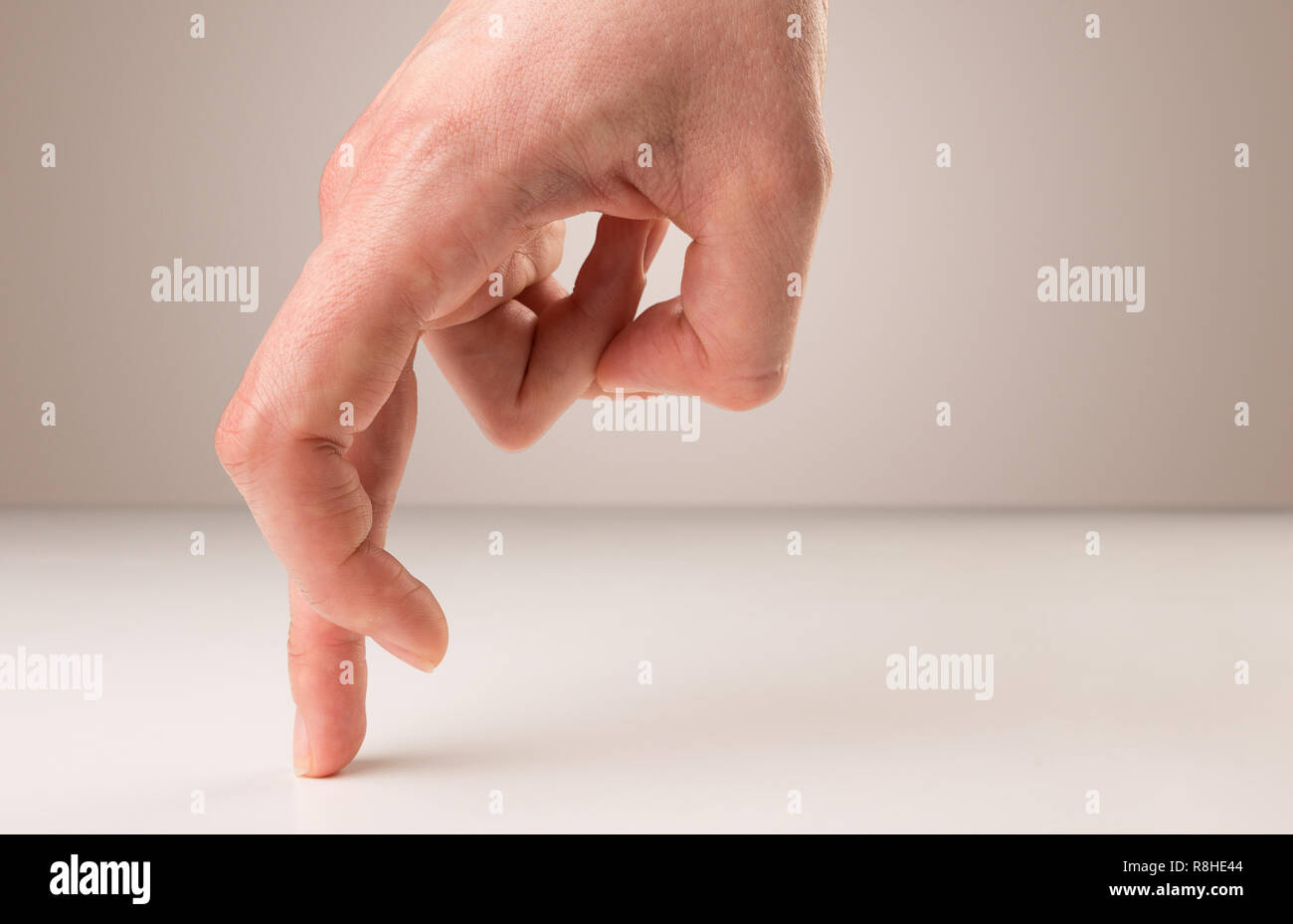 Female fingers walking on white surface Stock Photo - Alamy