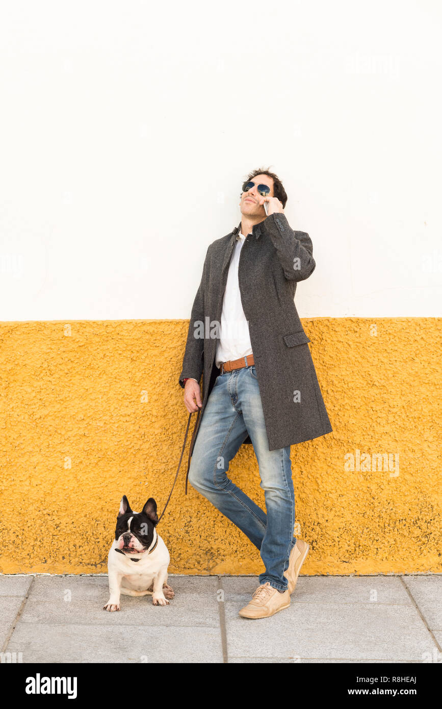 Man standing talking to a dog hi-res stock photography and images - Alamy
