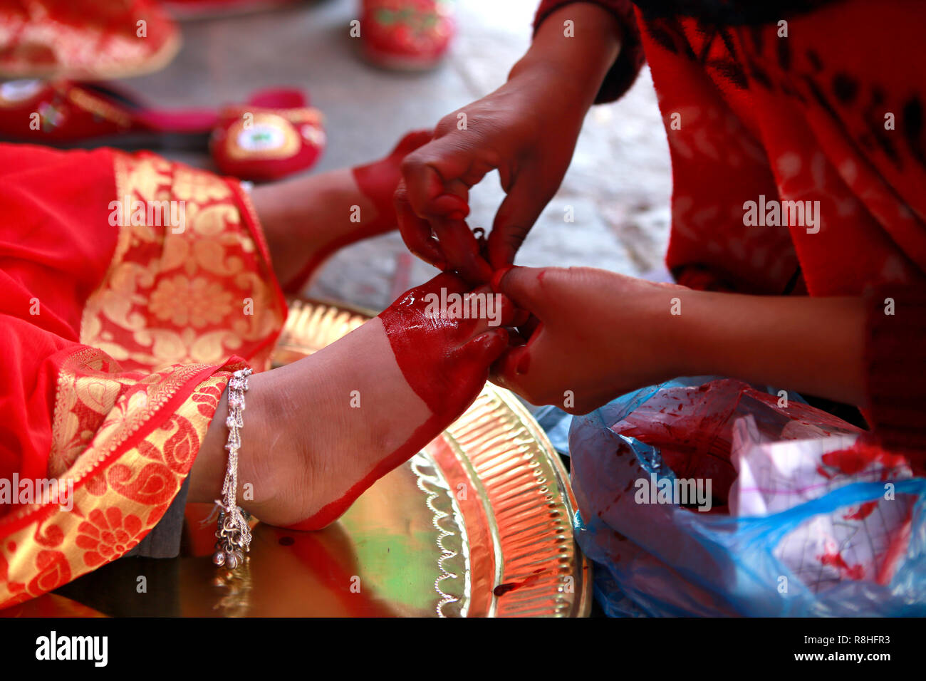 Kathmandu, Nepal, 15th December 2018. A foot of a Newar girl is being ...