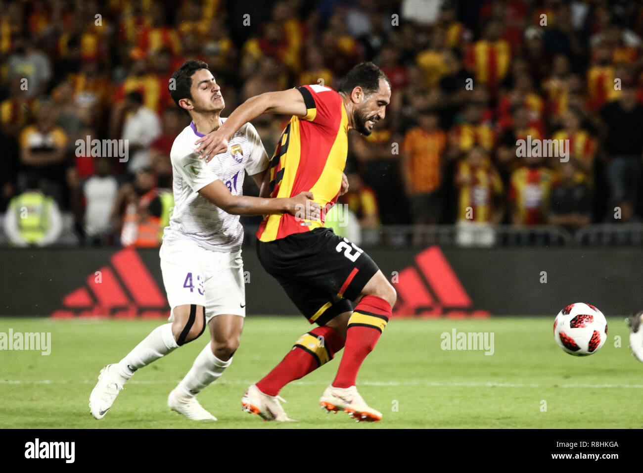Al Ain, United Arab Emirates. 15th Dec, 2018. Al Ain's Rayan Yaslam (L ...