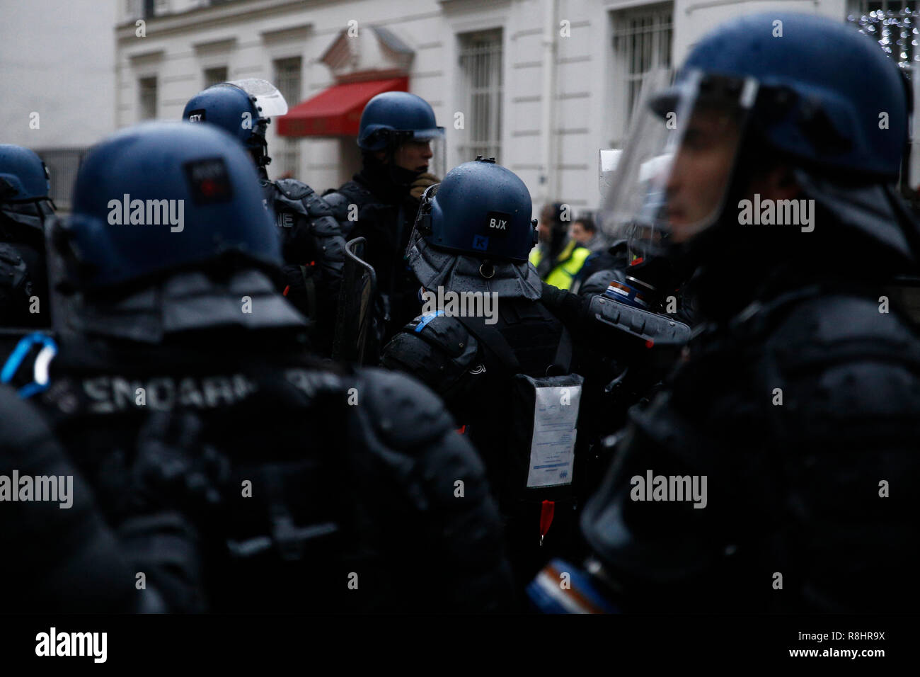 Paris, France. 15th December 2018. Riot Police uses a water canon and ...