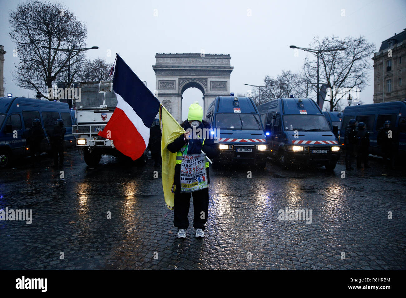 Paris, France. 15th December 2018. People take part in a protest march ...