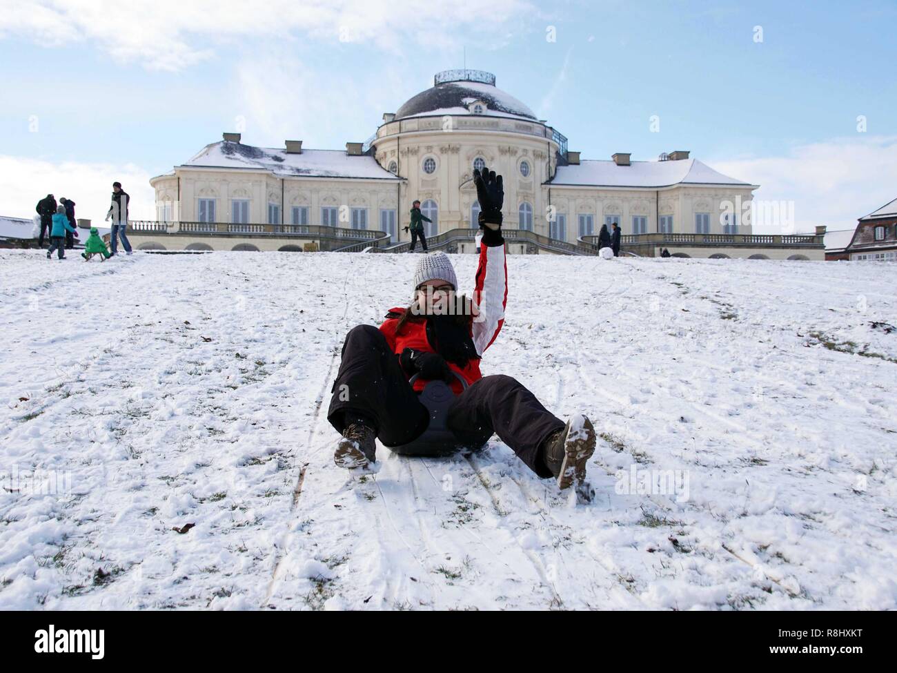 Stuttgart, Germany. 16th Dec, 2018. A laughing young woman sled down ...