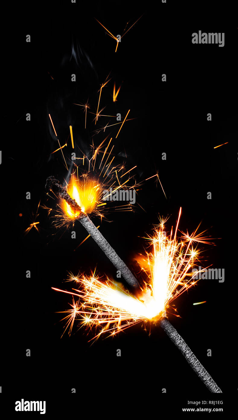 burning sparkler close-up on a black background Stock Photo - Alamy