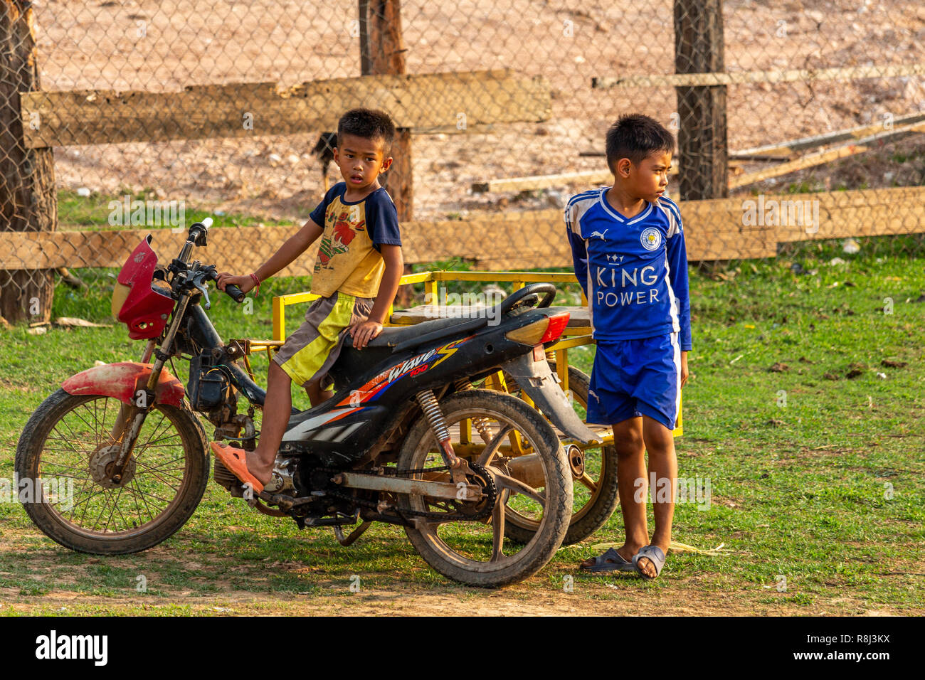 Thakhek, Laos - April 20, 2018: Two young kids posing on a motorbike in ...