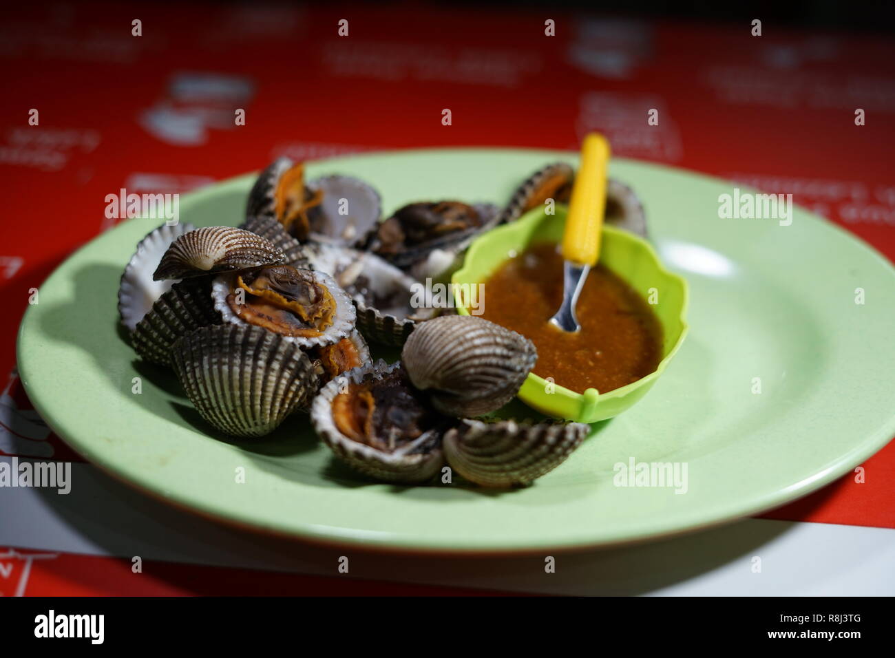 Fresh Boiled cockles with tasty sauce Stock Photo - Alamy