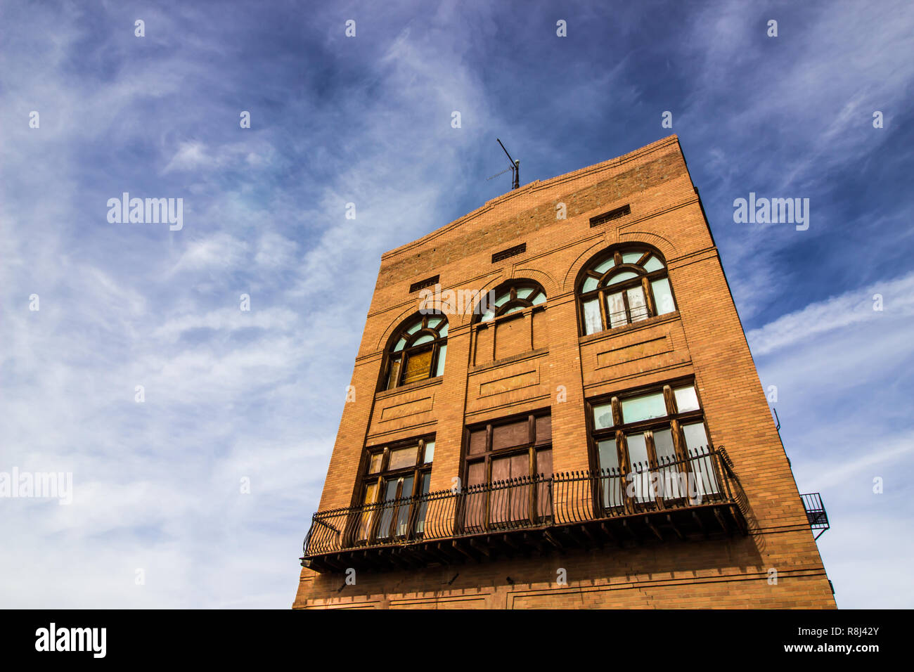 Vintage Multi Story Brick Building With Boarded Up Windows Stock Photo ...
