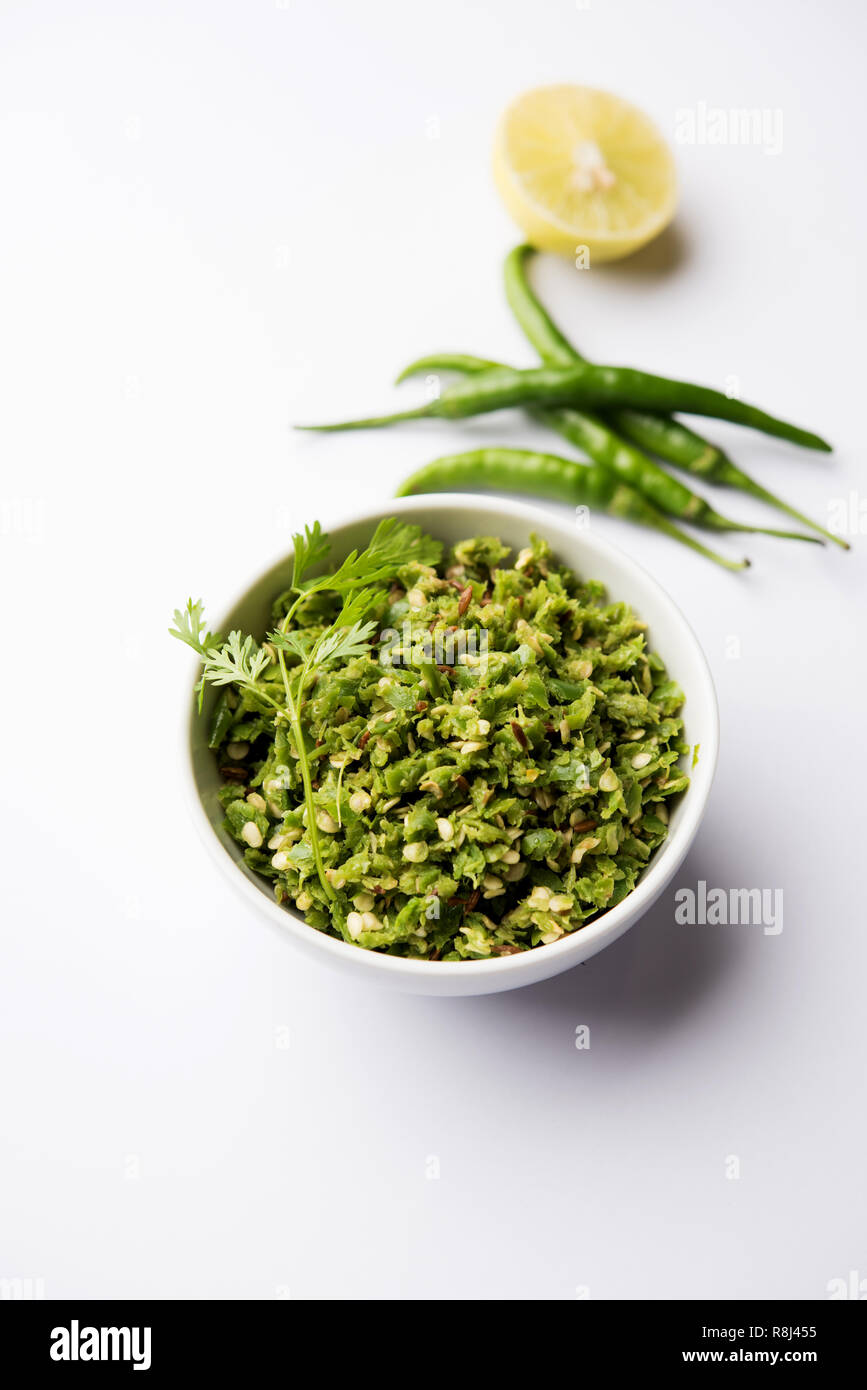 Hot and spicy green chilli chutney using hari mirch, cumin seeds, lemon ...