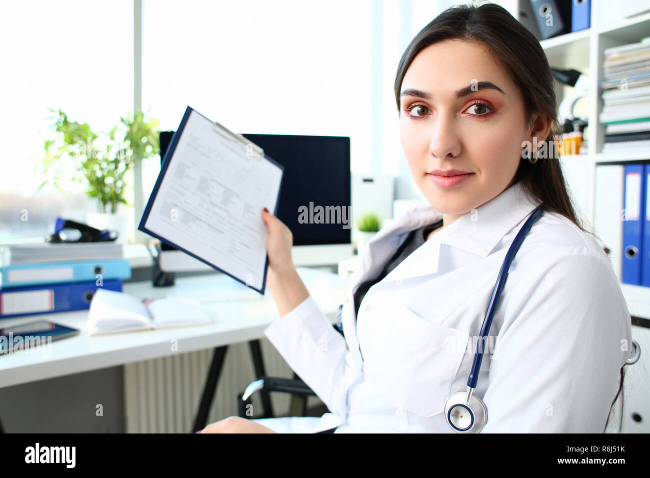 Beautiful smiling female doctor at workplace portrait Stock Photo - Alamy
