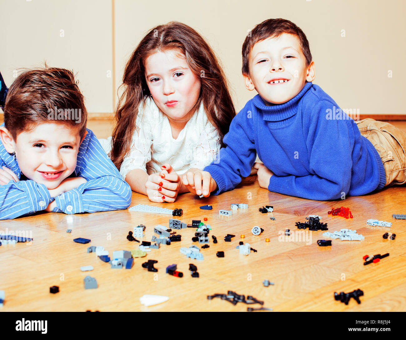 funny cute children playing toys at home, boys and girl smiling Stock ...