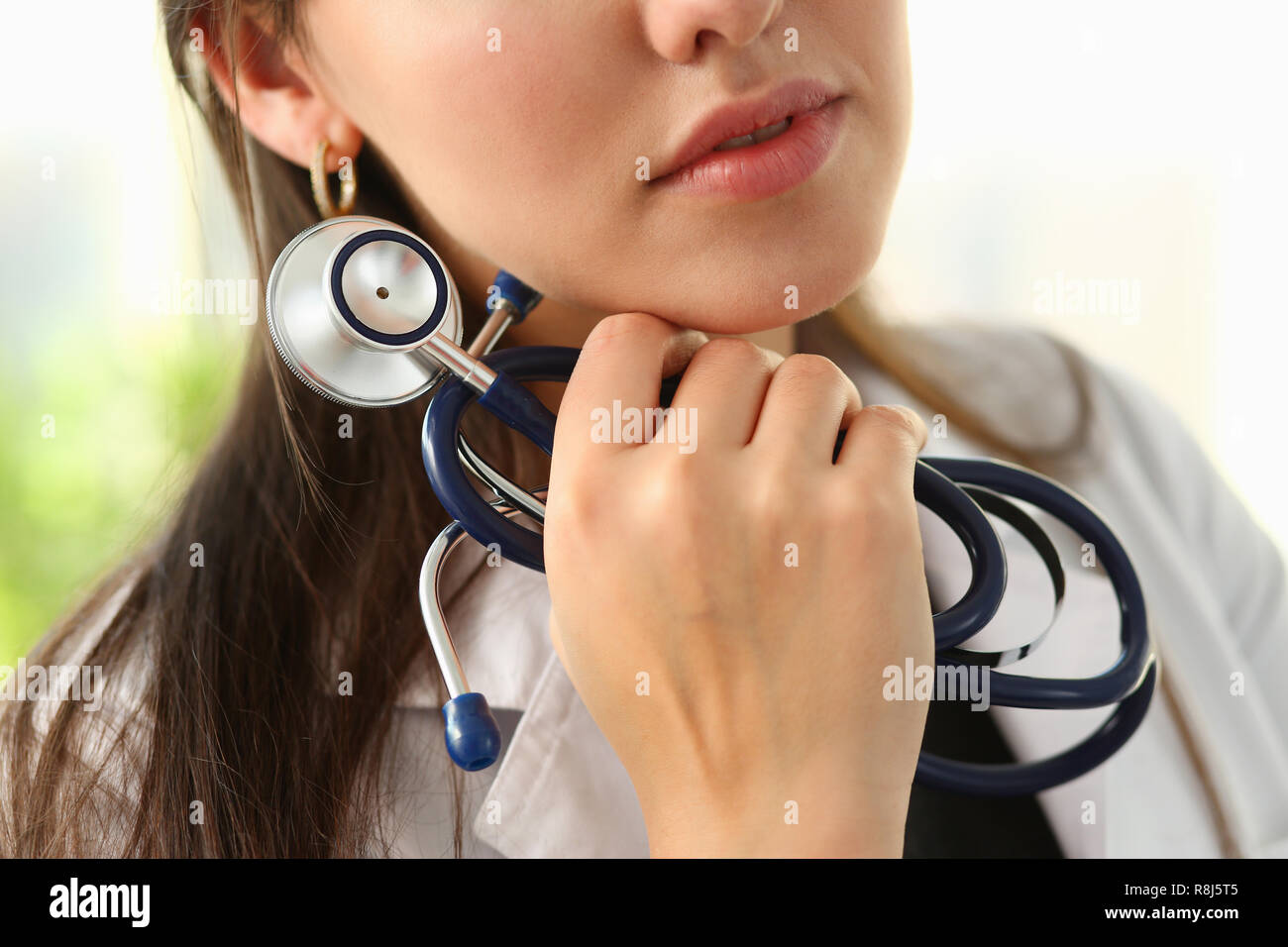 Female doctor hand hold phonendoscope in medical Stock Photo - Alamy