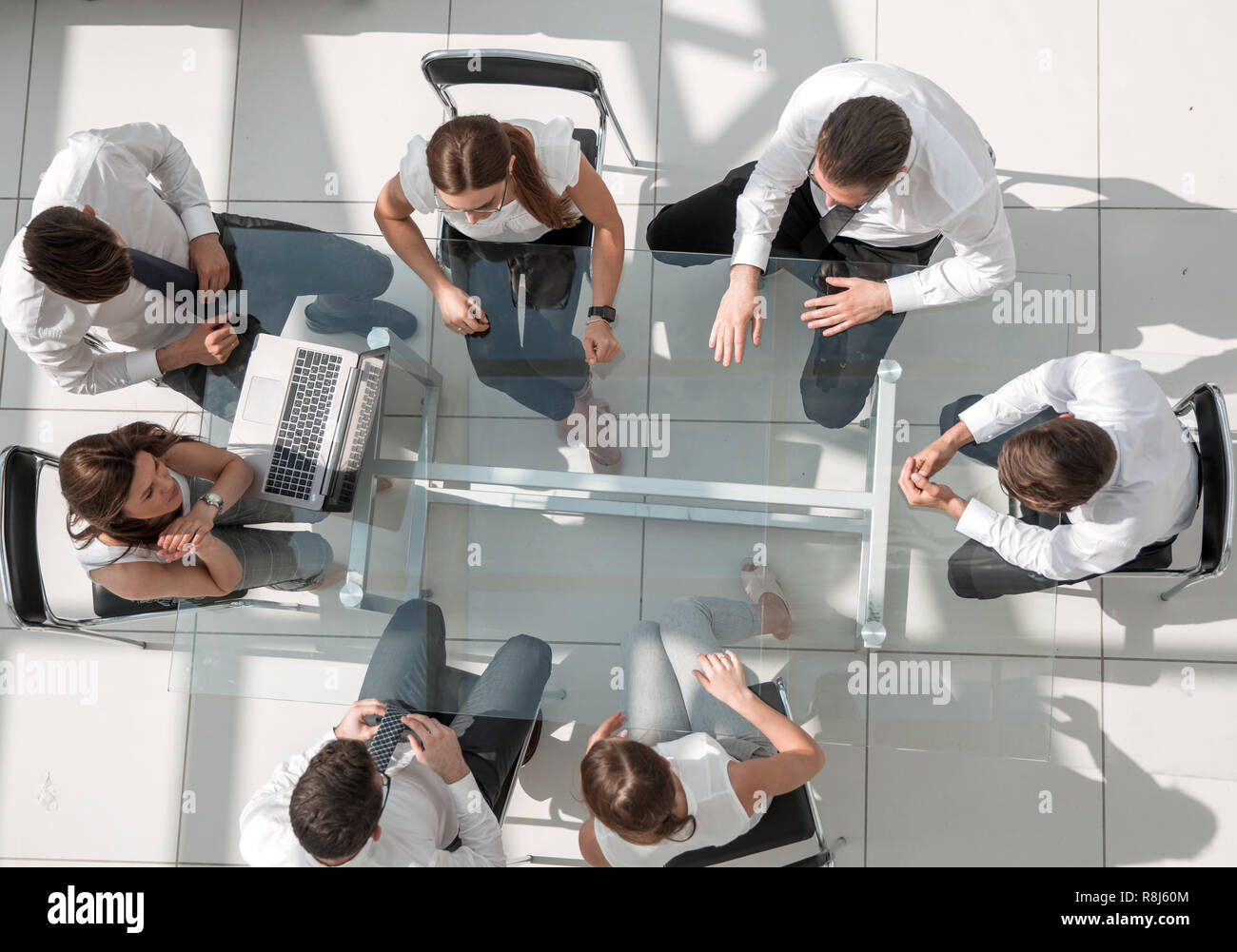top view.business team sitting at the office table Stock Photo - Alamy