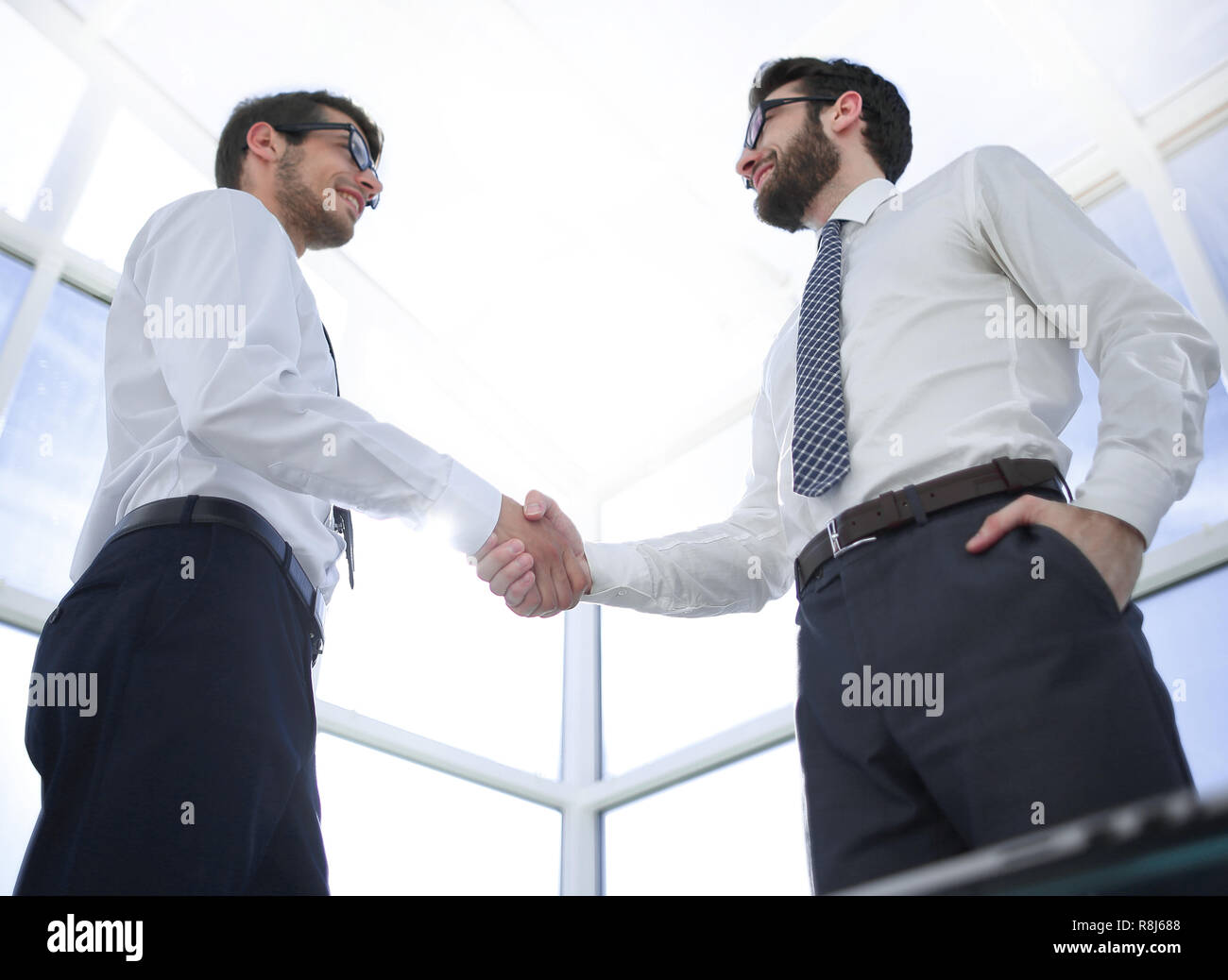 bottom view.handshake business partners standing in the office Stock ...