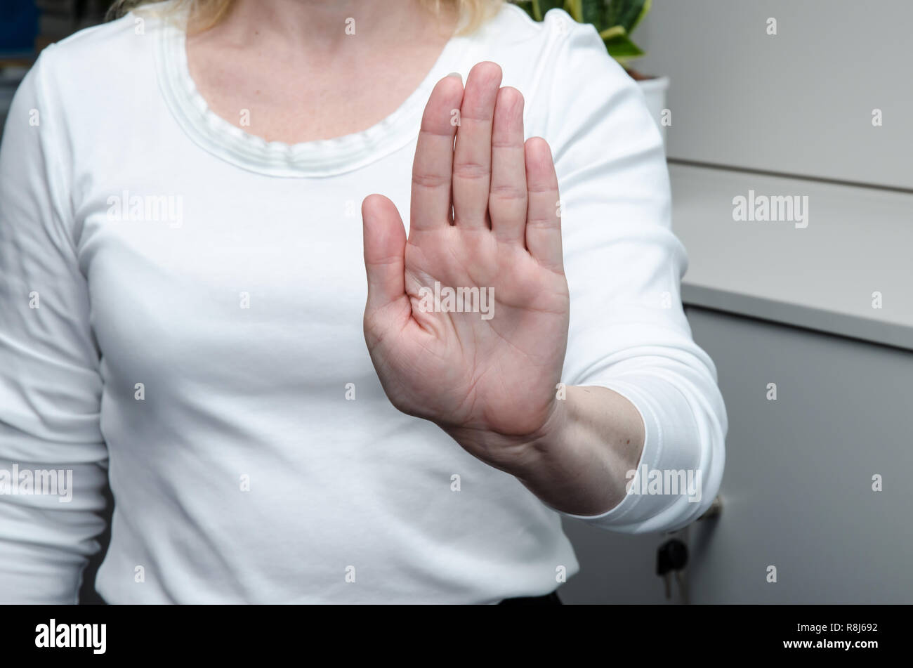 hand with stop gesture on white background Stock Photo - Alamy