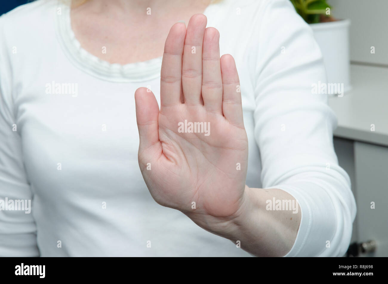 hand with stop gesture on white background Stock Photo - Alamy