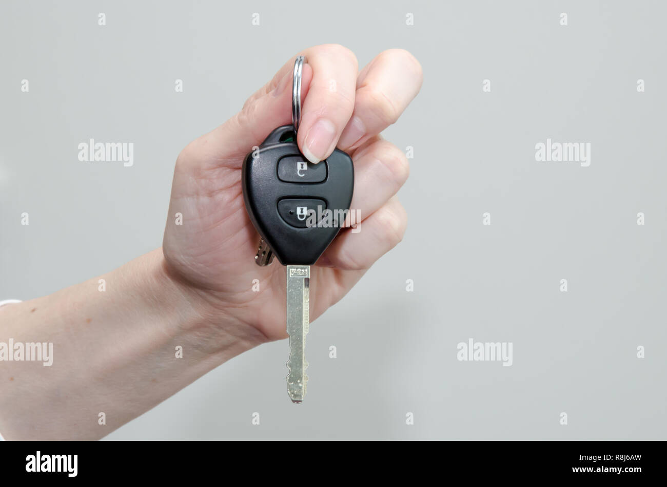 hand with keys on white background Stock Photo - Alamy