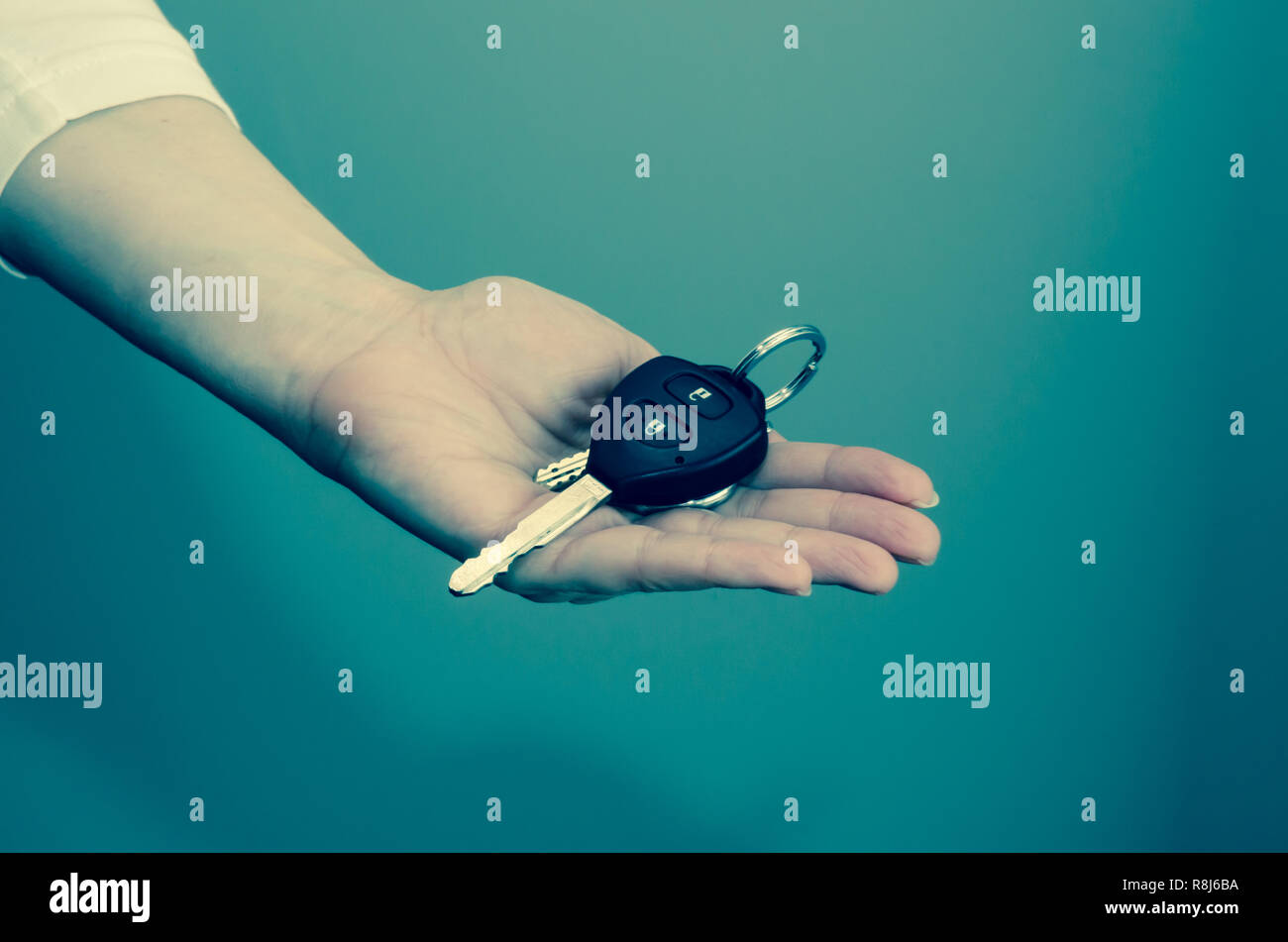 hand with keys on white background Stock Photo - Alamy