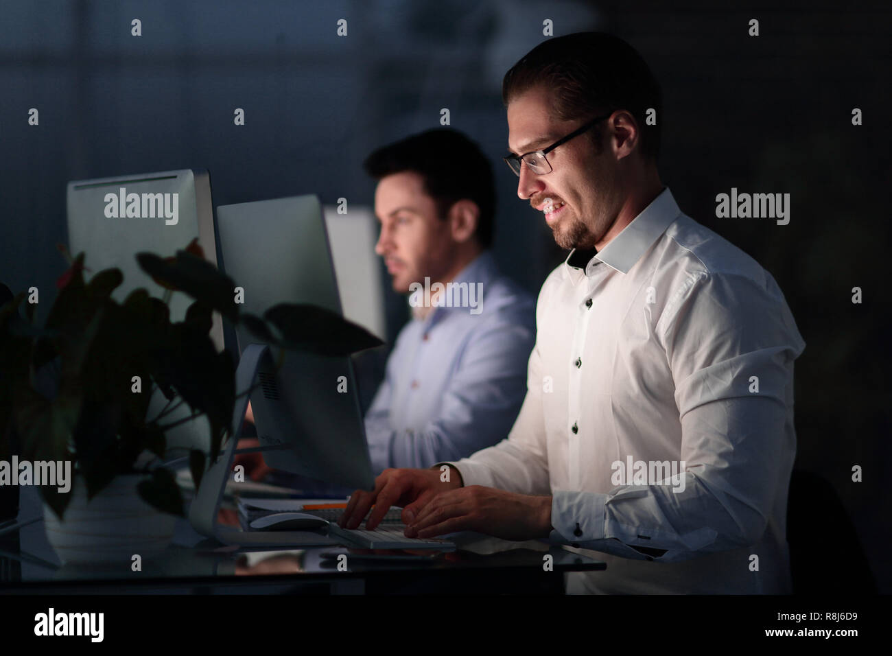 close up.employee of the company working after hours Stock Photo - Alamy