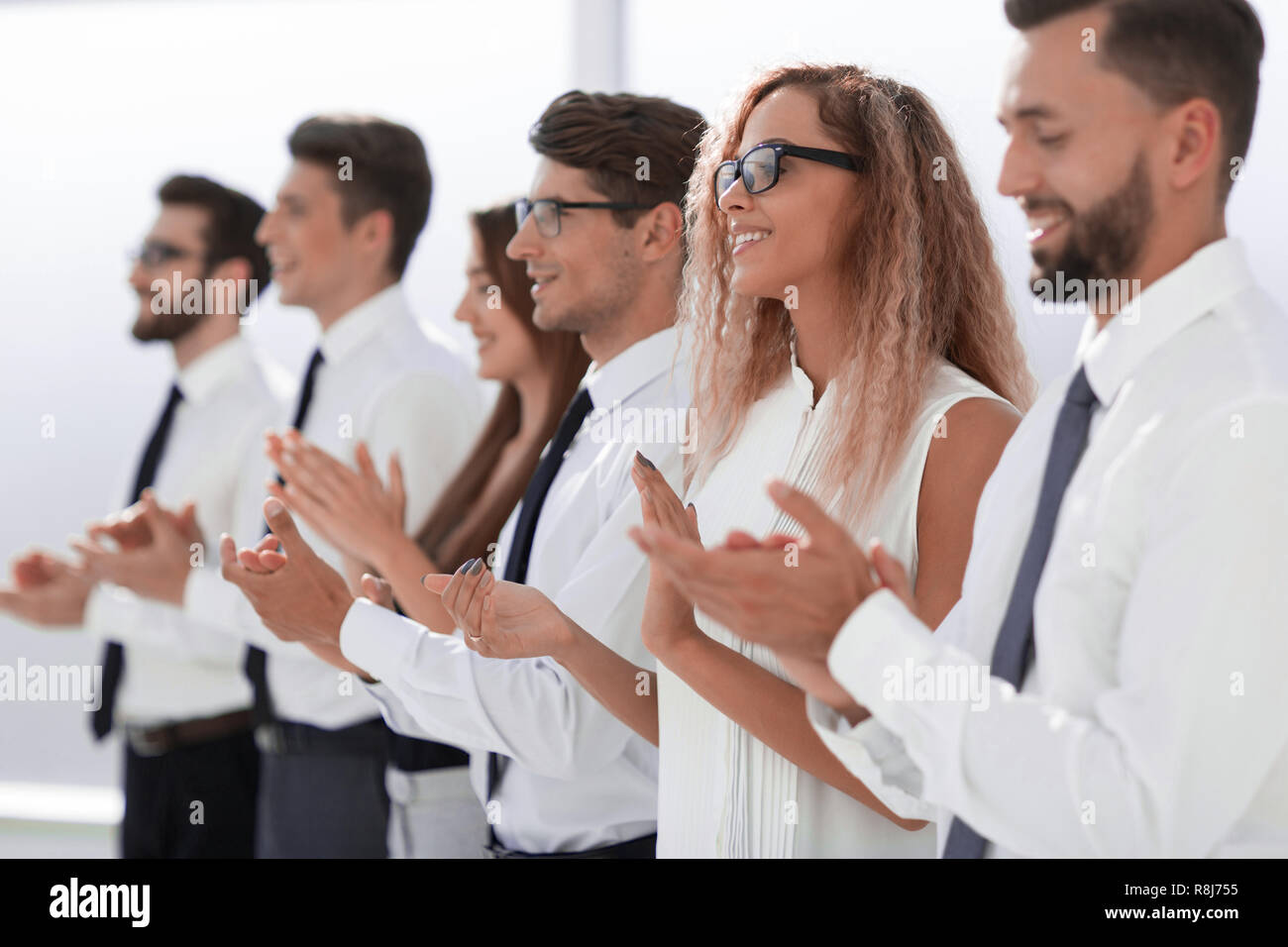 Applauding leadership smiling standing hi-res stock photography and ...
