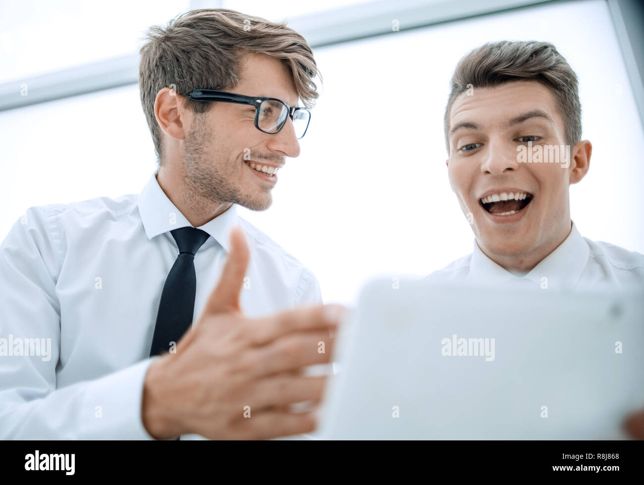close up.young employees use a digital tablet Stock Photo - Alamy