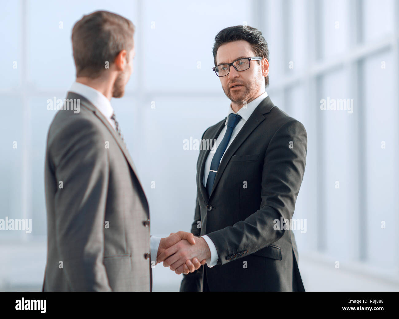 friendly handshake of business partners Stock Photo - Alamy