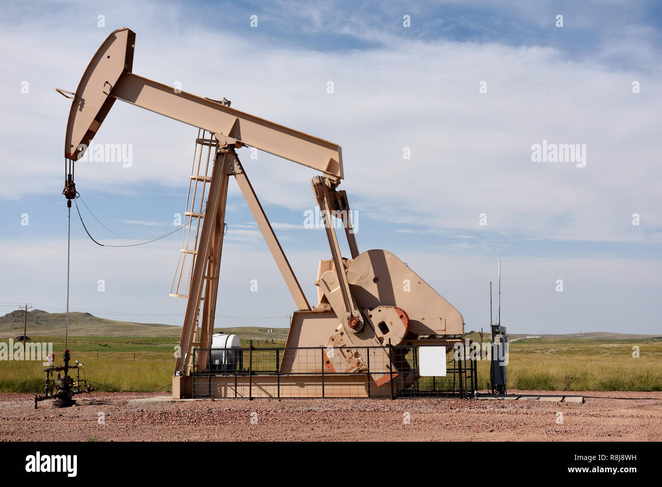 Crude oil production well site pump jack and fields in the Niobrara ...