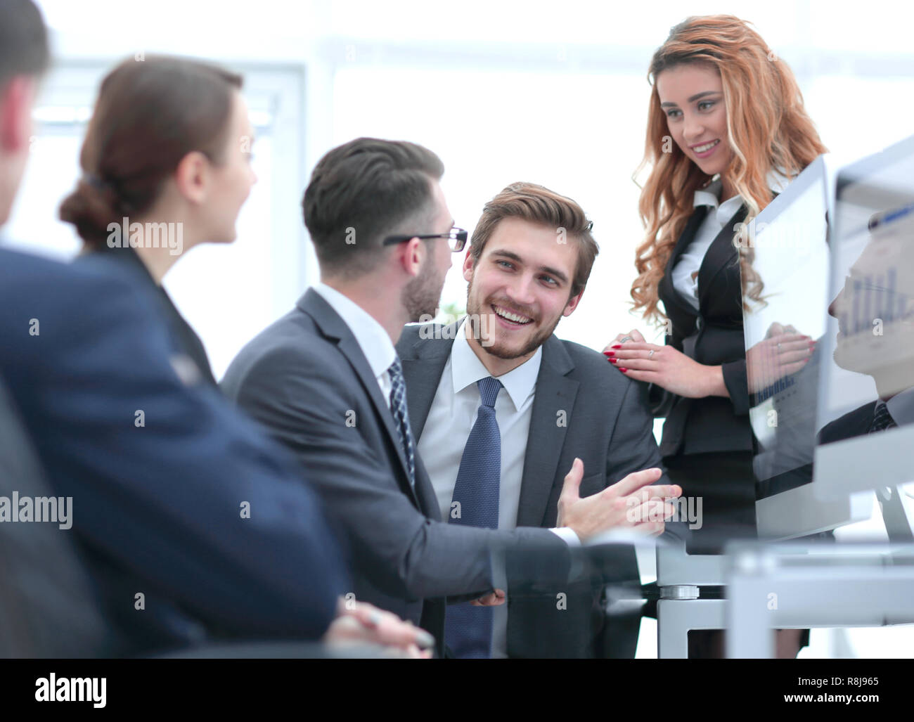 employees discussing financial charts Stock Photo - Alamy