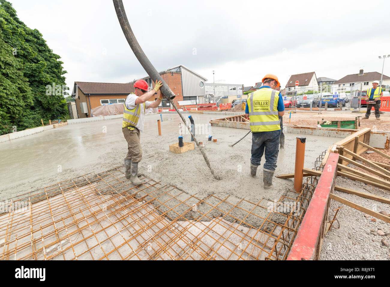 Pouring the concrete slab at Maggies Cardiff Stock Photo - Alamy