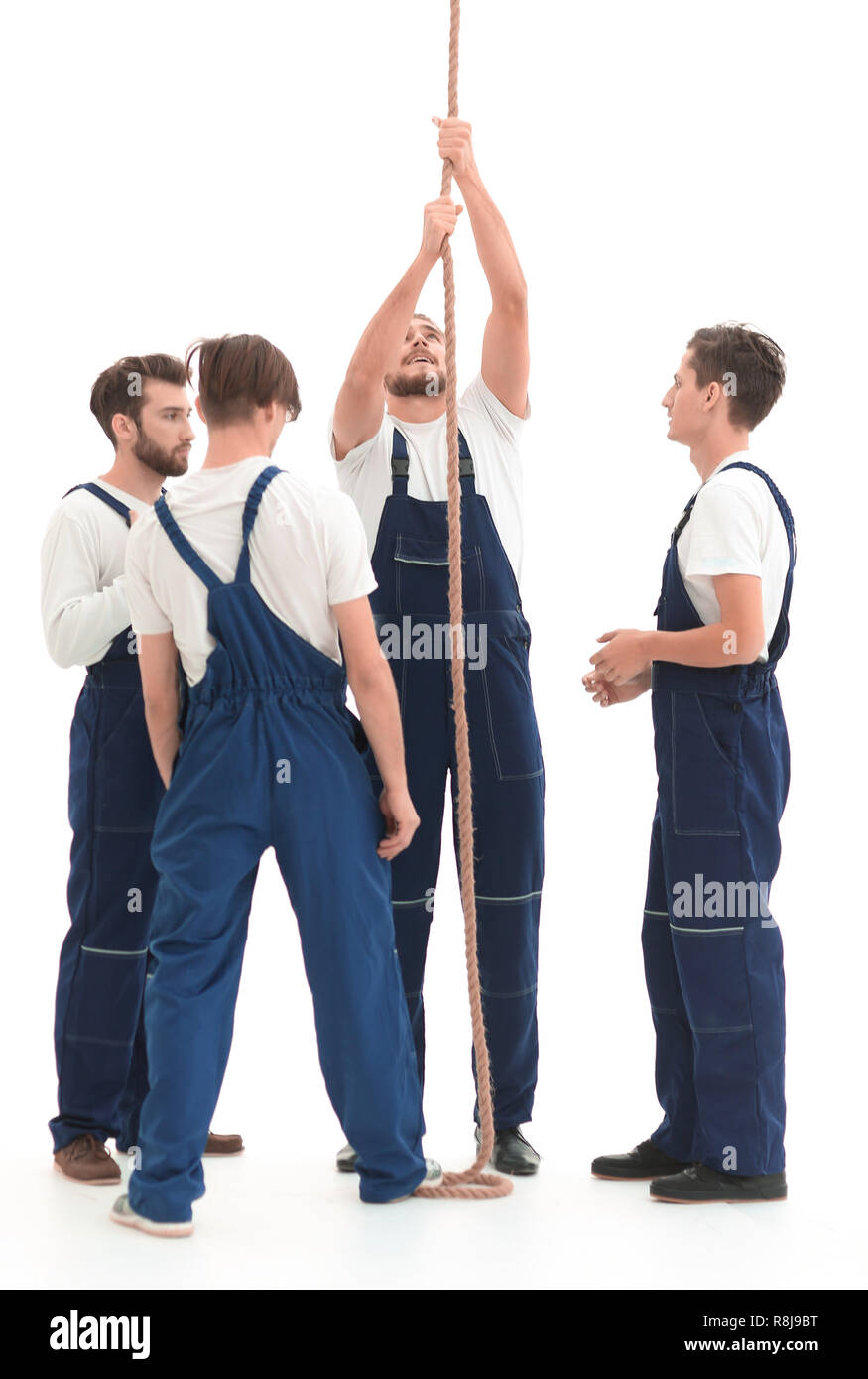 view from the top. team work in helping the leader to climb up Stock ...